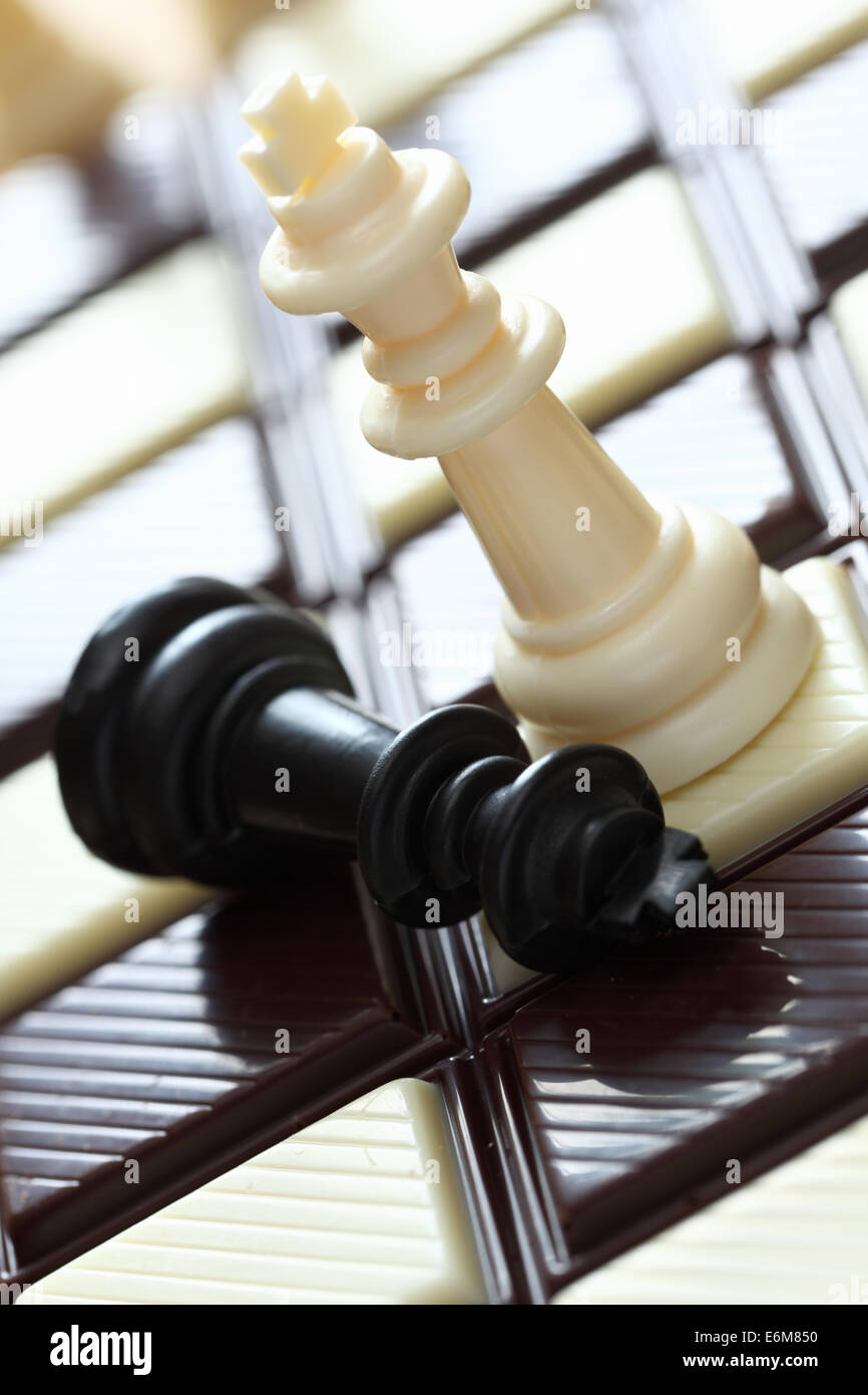 Defeat. Chess on the chocolate chessboard. Closeup Stock Photo - Alamy
