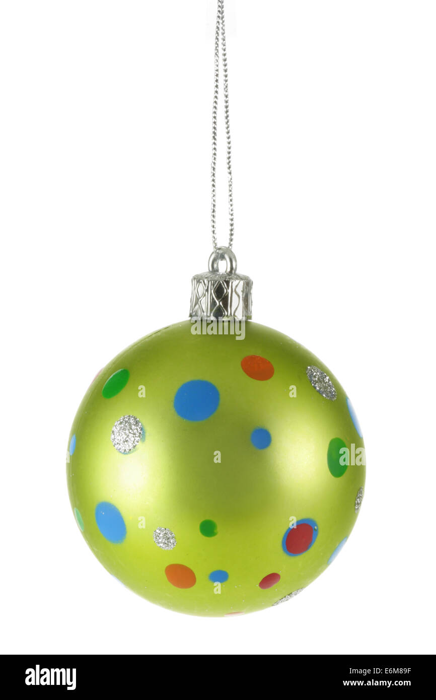 Light-green Christmas ball with colorful spots isolated over white ...