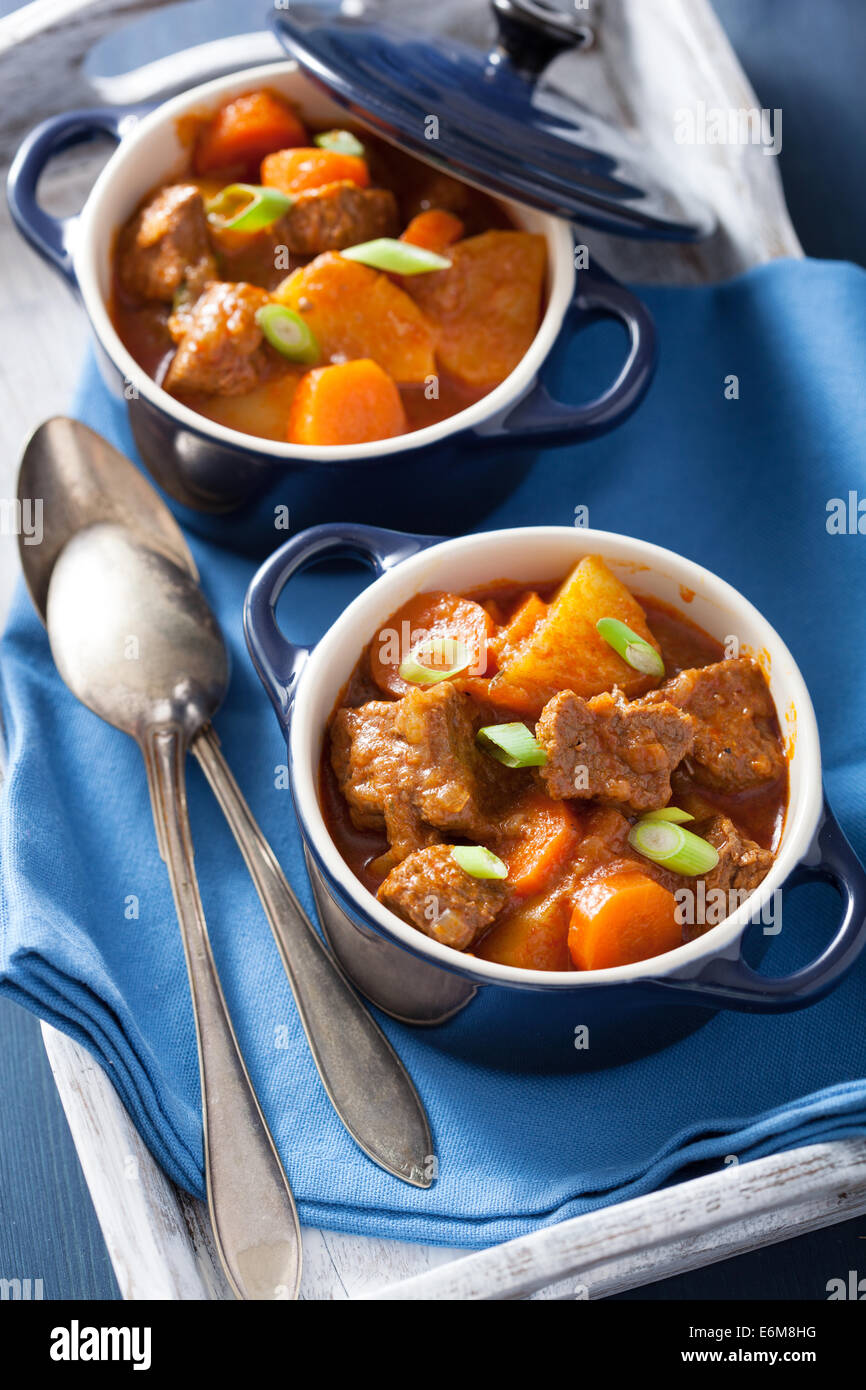 beef stew with potato and carrot in blue pots Stock Photo - Alamy