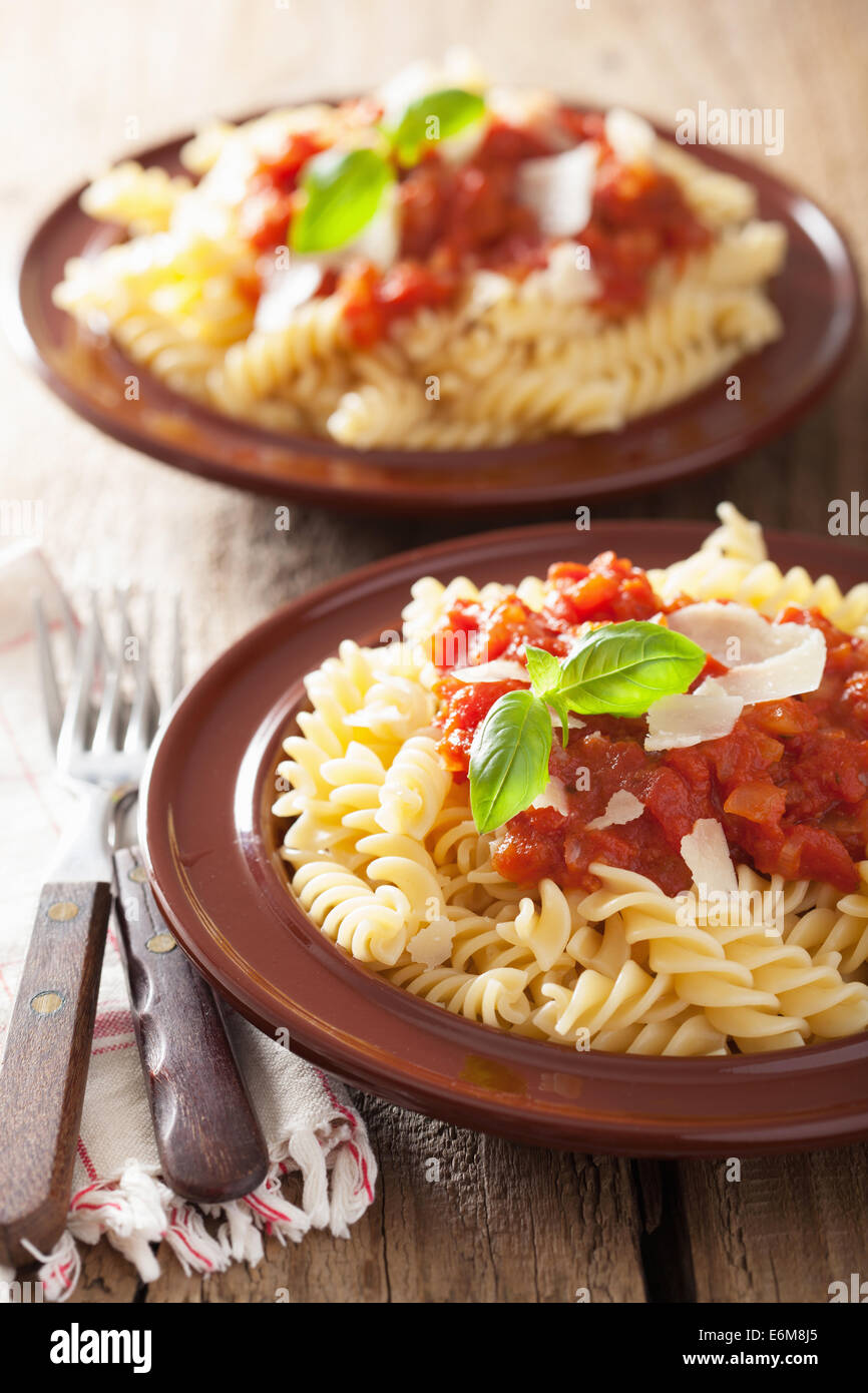 italian classic pasta fusilli with tomato sauce and basil Stock Photo ...