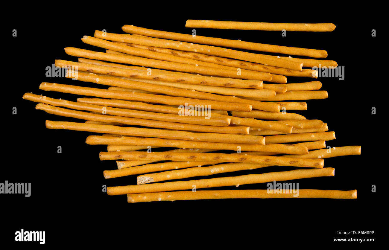 Grop of sticks isolated over black background Stock Photo - Alamy