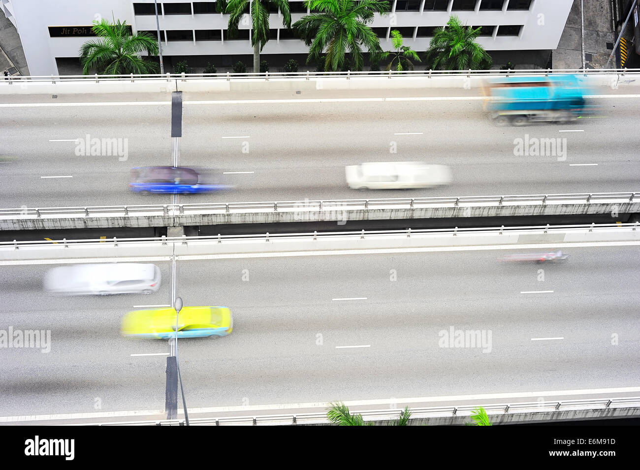 Fast traffic on a highway in Singapore. Long exposure Stock Photo - Alamy