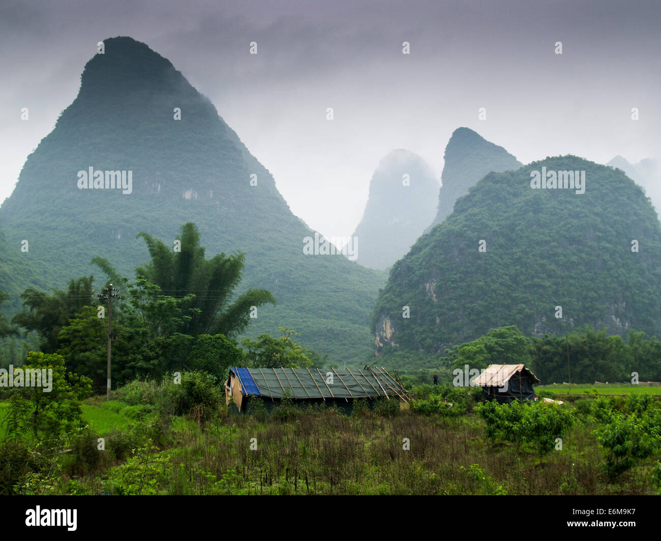 Farm shacks in dramatic limestone peaks, Guilling countryside, China ...