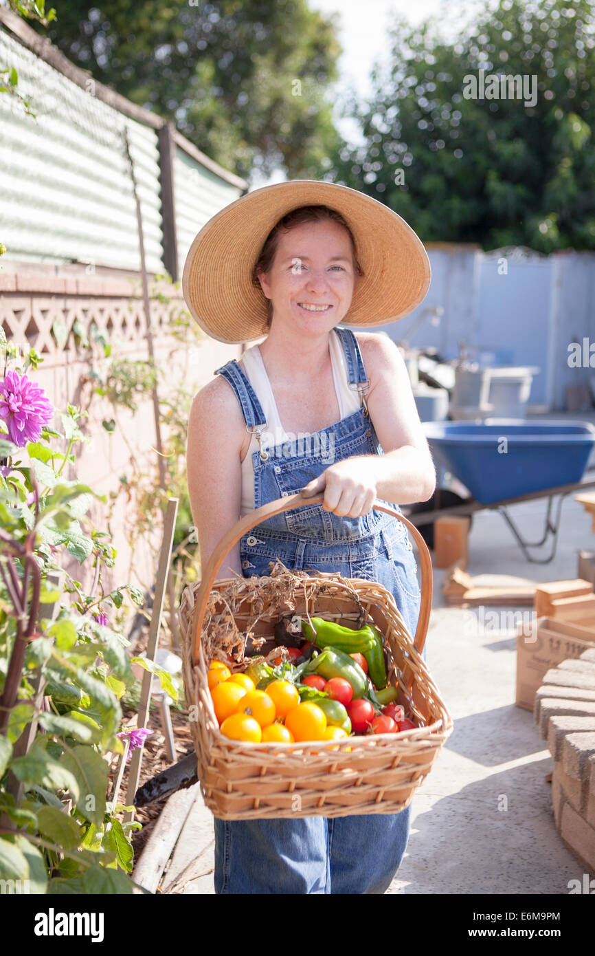 View of woman in garden Stock Photo - Alamy