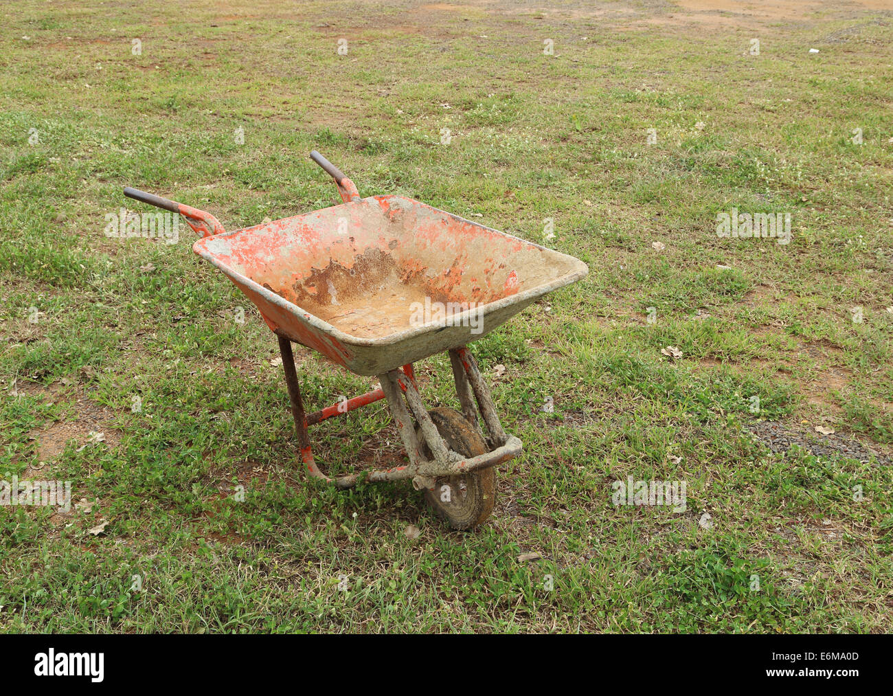 Old wheelbarrow on grass field Stock Photo - Alamy
