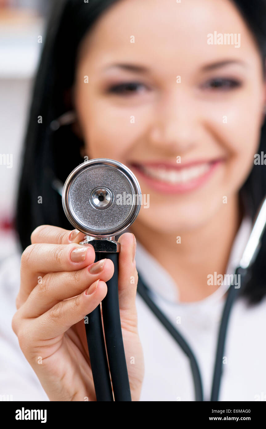 Beautiful female doctor using stethoscope hi-res stock photography and ...