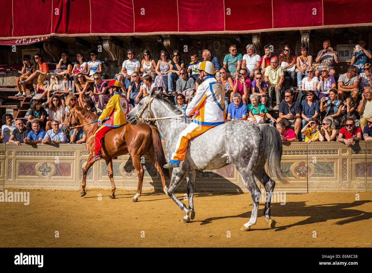 Jockeys waiting for the start of Palio di Siena horse race on Piazza ...