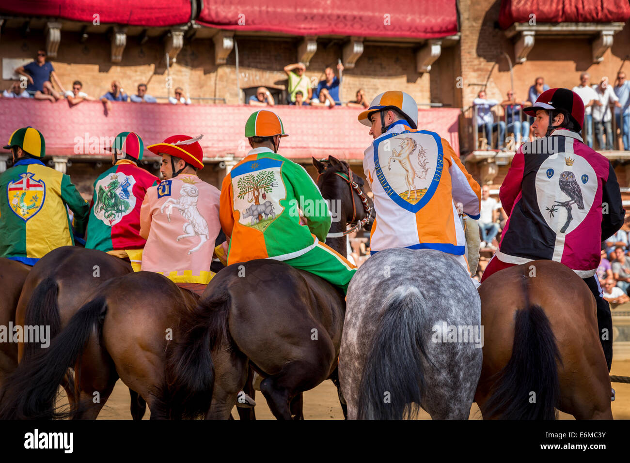 Jockeys waiting for the start of Palio di Siena horse race on Piazza ...