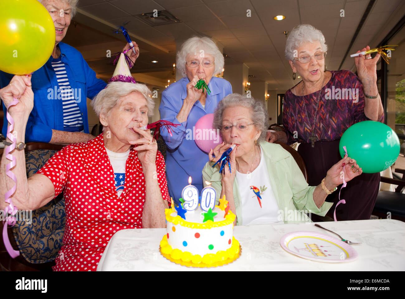 Elderly women celebrating birthday Stock Photo - Alamy