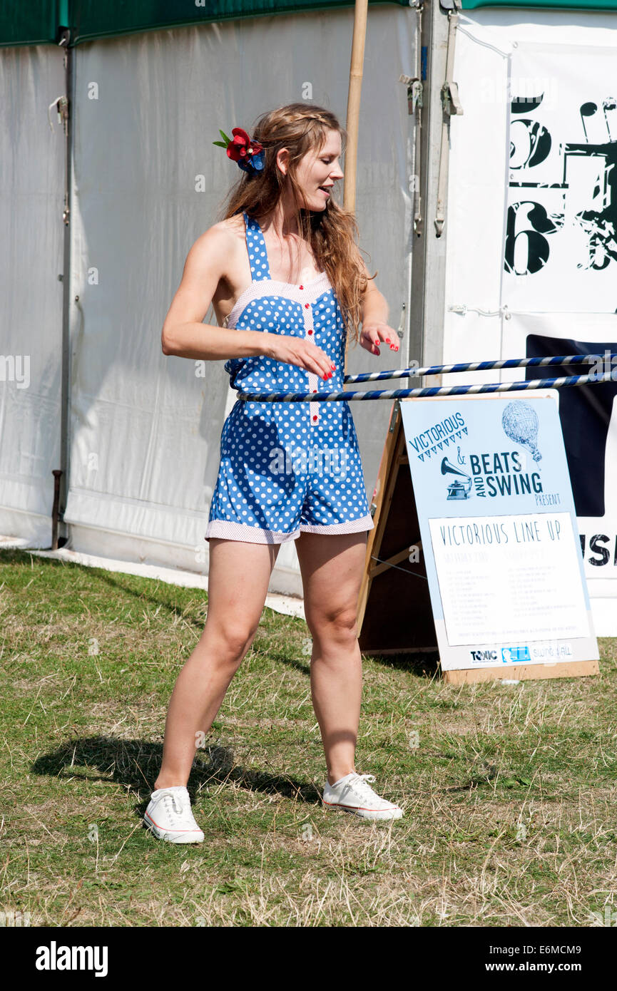 young woman playing with a hula hoop at the victorious festival 2014 ...