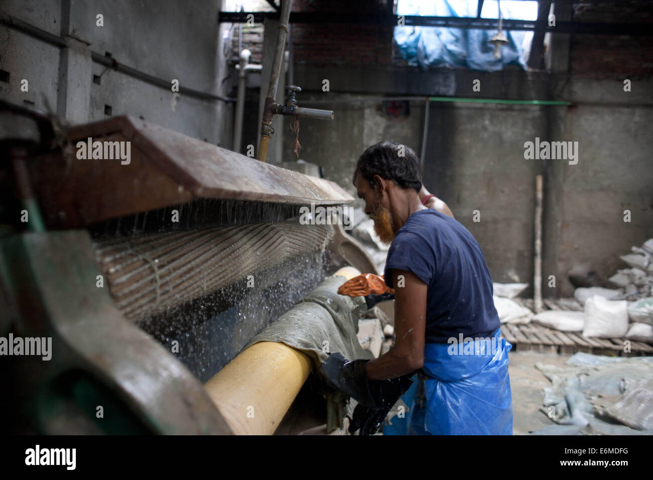 Dhaka, Bangladesh. 26th Aug, 2014. Bangladeshi tannery workers process ...