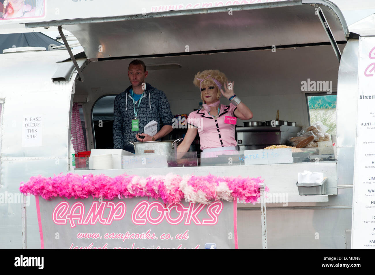 a man in drag sells food from camp cooks fast food stall at victorious ...
