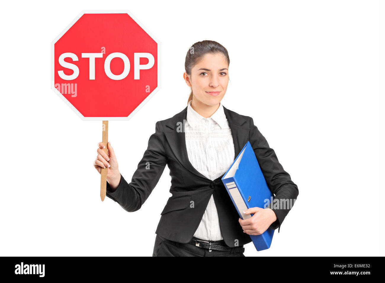 Businesswoman holding a stop sign Stock Photo - Alamy