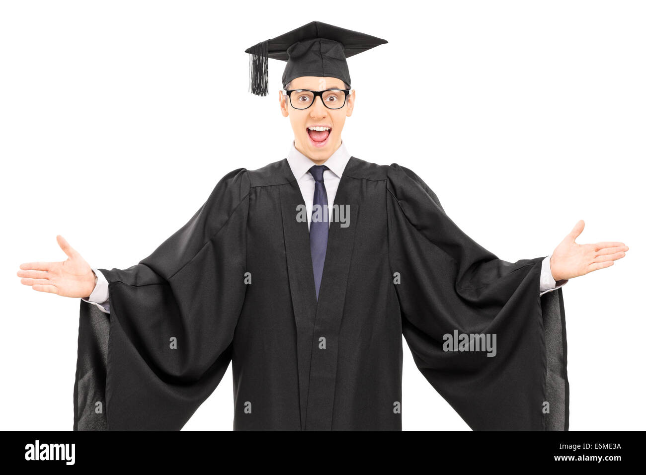 Male student in graduation gown gesturing with hands isolated on white ...