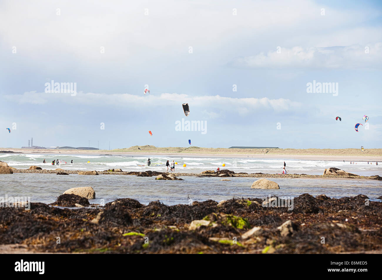 Kite surfers and wind surfers, Rhosneigr Beach, Anglesey, Valley in the ...