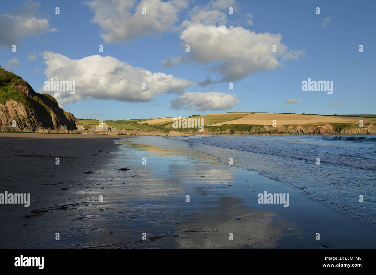 Reflection of the clouds on the sand on Mothecombe beach in Devon Stock ...