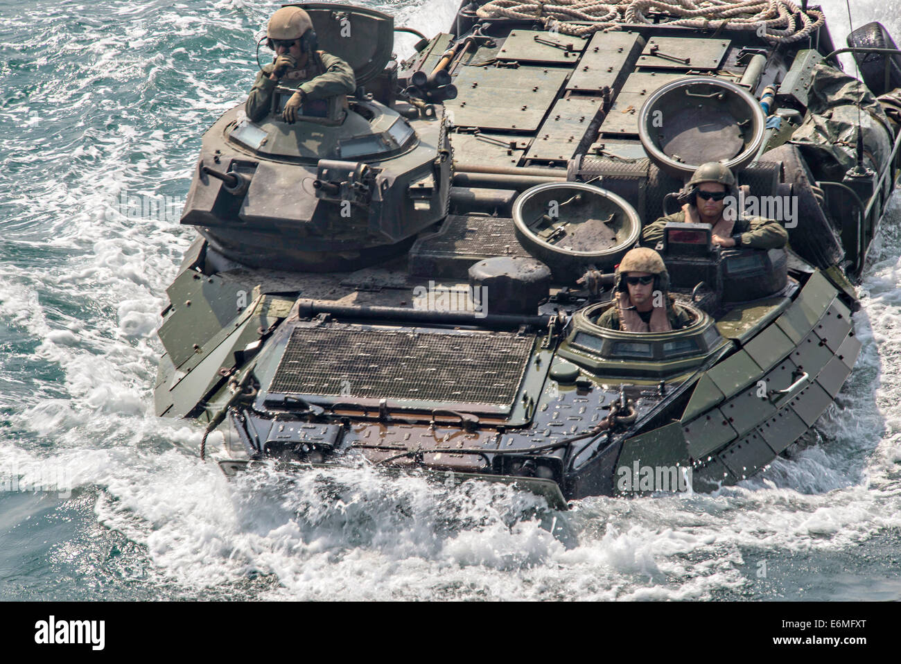 US Marines in an amphibious assault vehicle exit the well deck of the ...