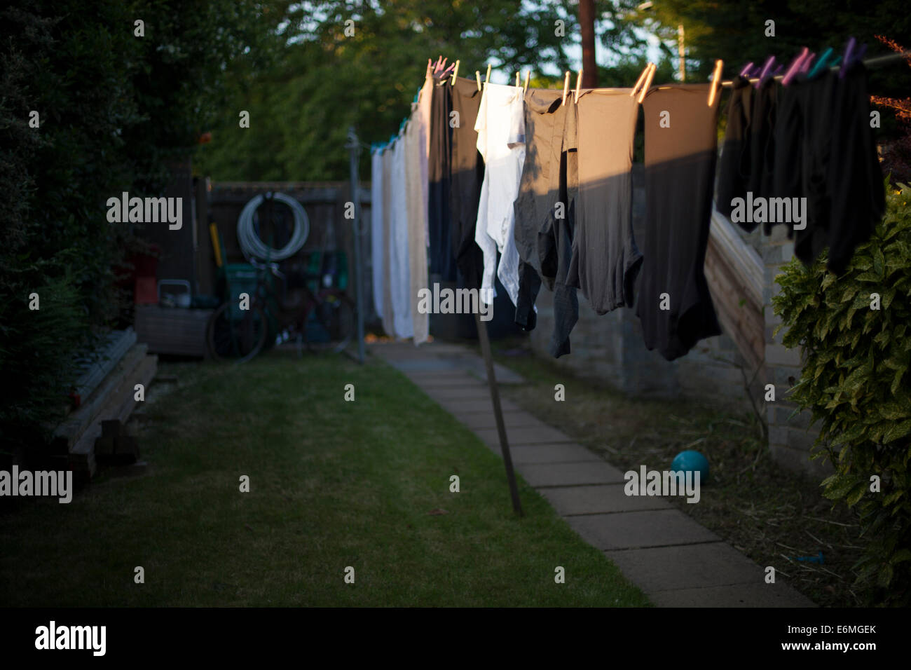 Washing line in garden during summer evening Stock Photo - Alamy