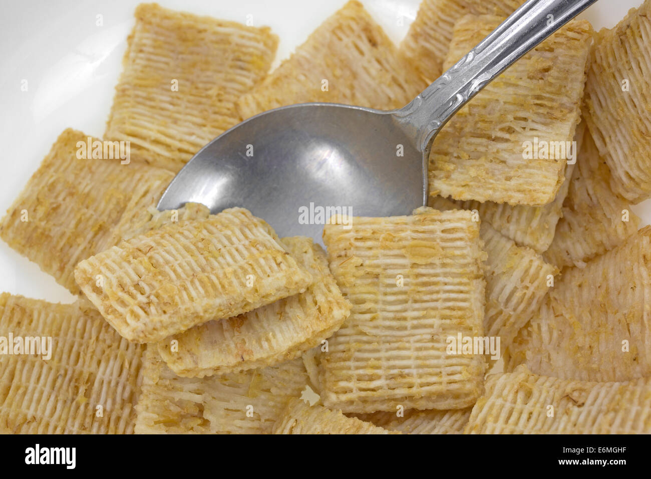 A close view of leftover breakfast cereal in the bottom of a bowl with ...