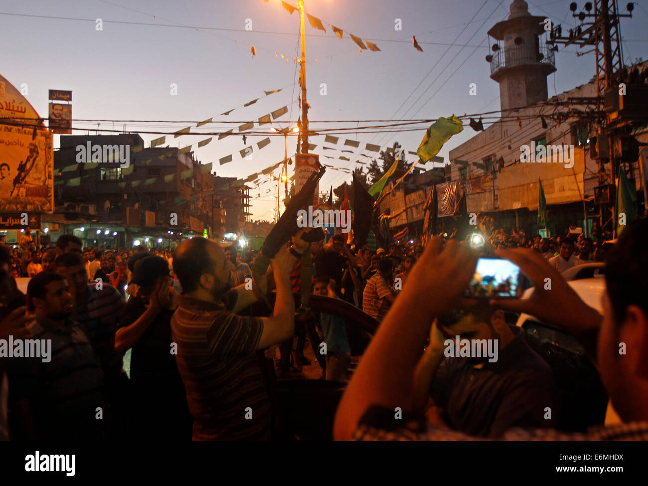 Gaza. 26th August, 2014. Palestinians celebrate what they said was a ...