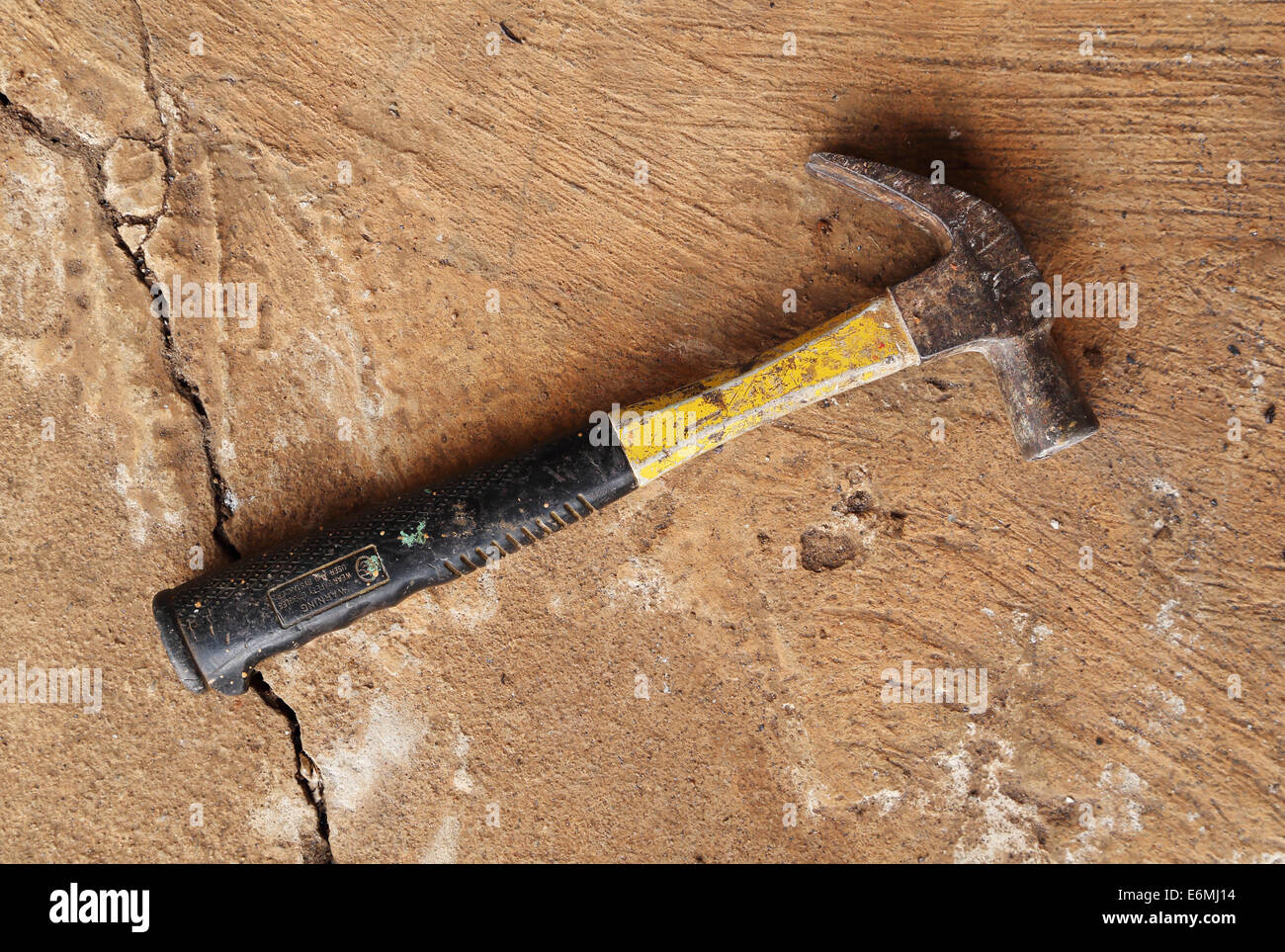 Old hammer on cement floor background Stock Photo - Alamy