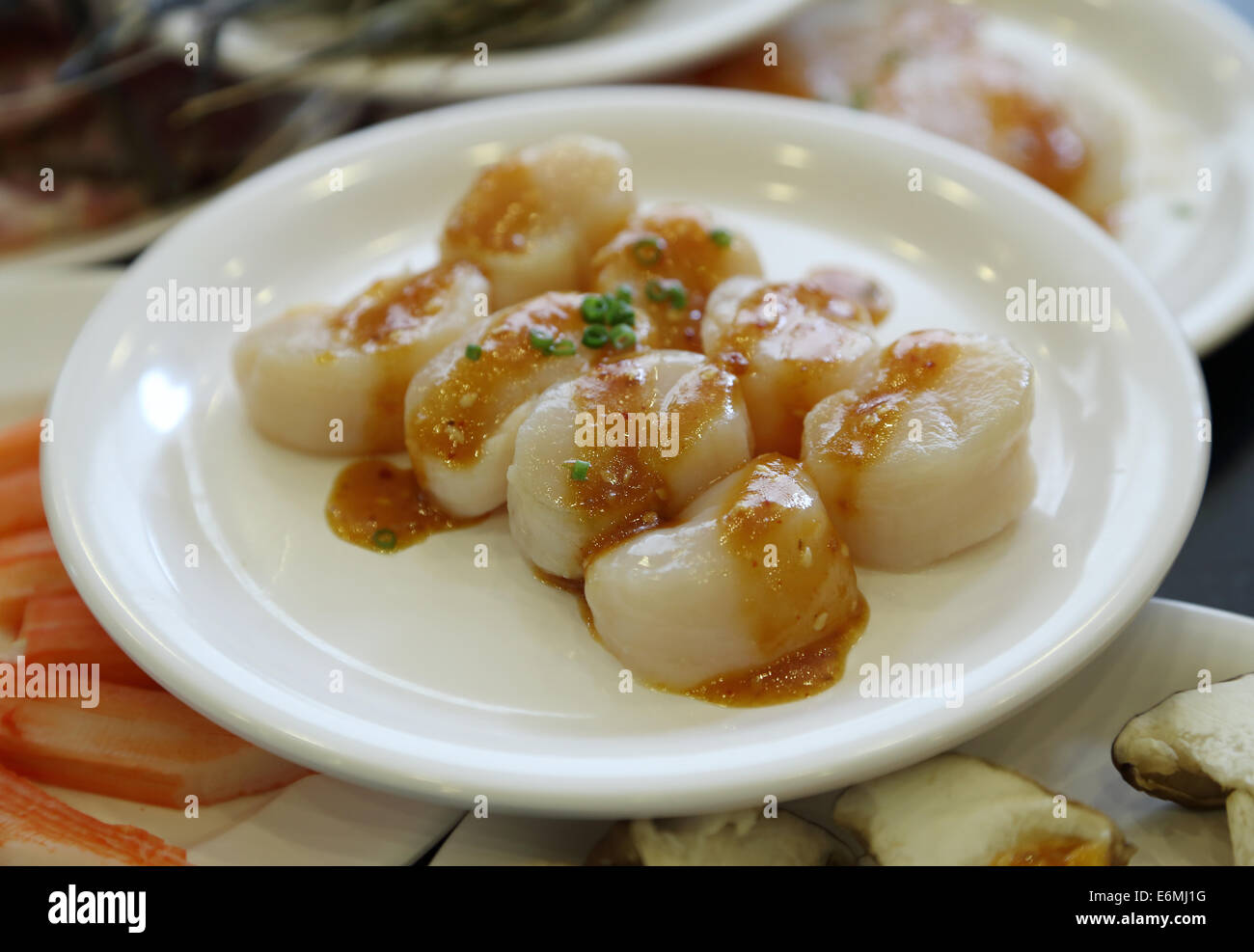 Shellfish food with sauce in plate Stock Photo - Alamy