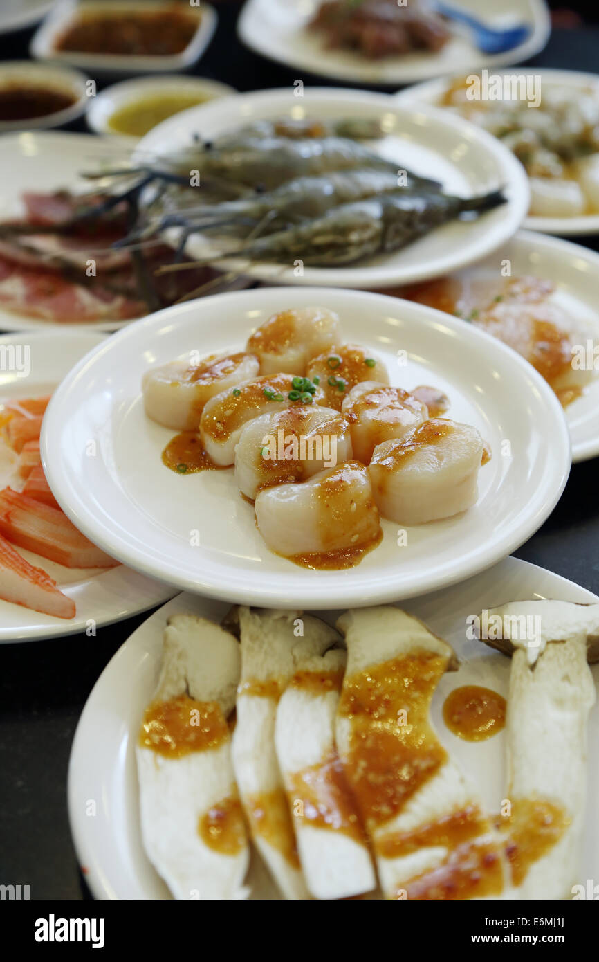 Shellfish food with sauce in plate Stock Photo - Alamy