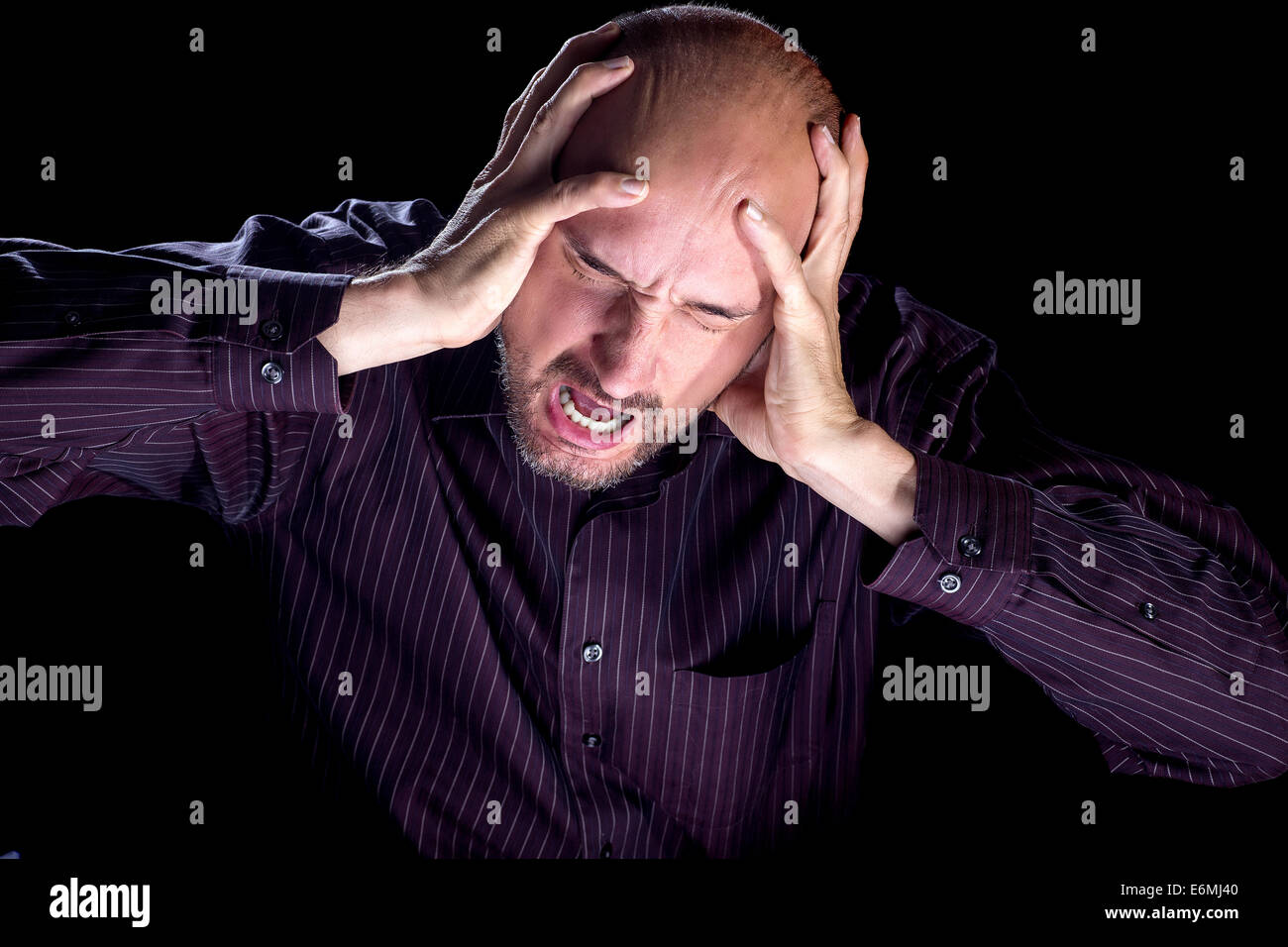 a dramatic image of a man yelling. He is very stressed out and the ...