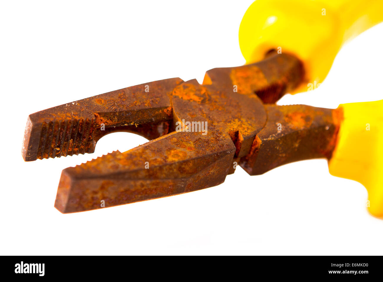 really old rusty pliers with yellow on white background Stock Photo - Alamy