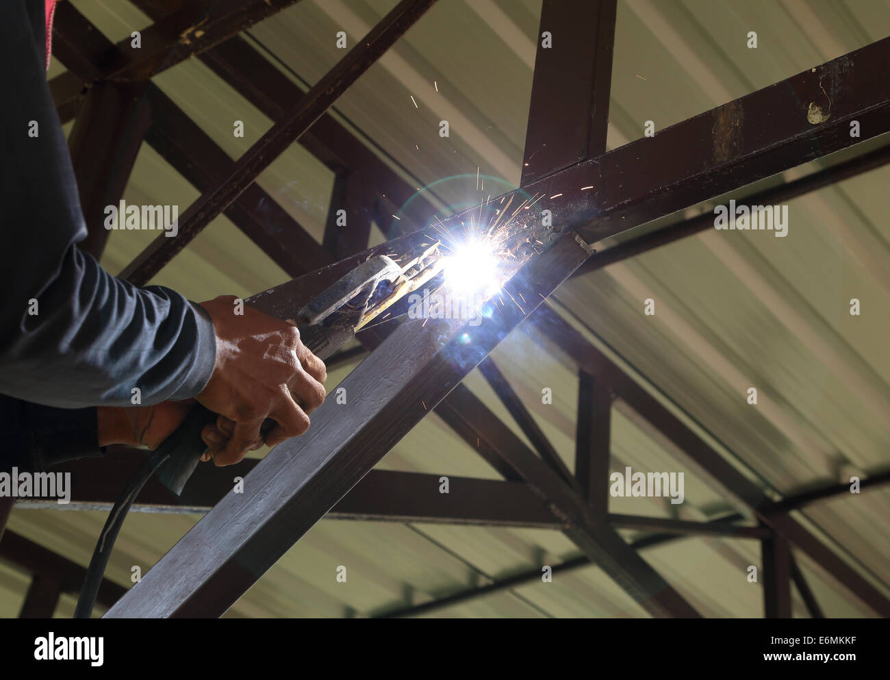 worker use electric welding connecting construction metal Stock Photo ...