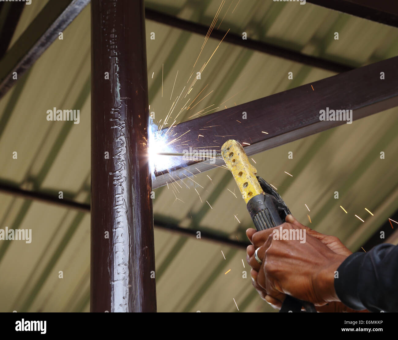 worker use electric welding connecting construction metal Stock Photo ...
