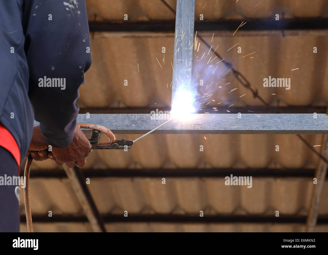 worker use electric welding connecting construction metal Stock Photo ...