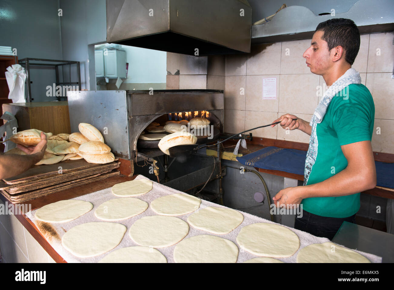 Baking Pita bread in a local bakery in Wadi Nisnas, Haifa's Arab ...