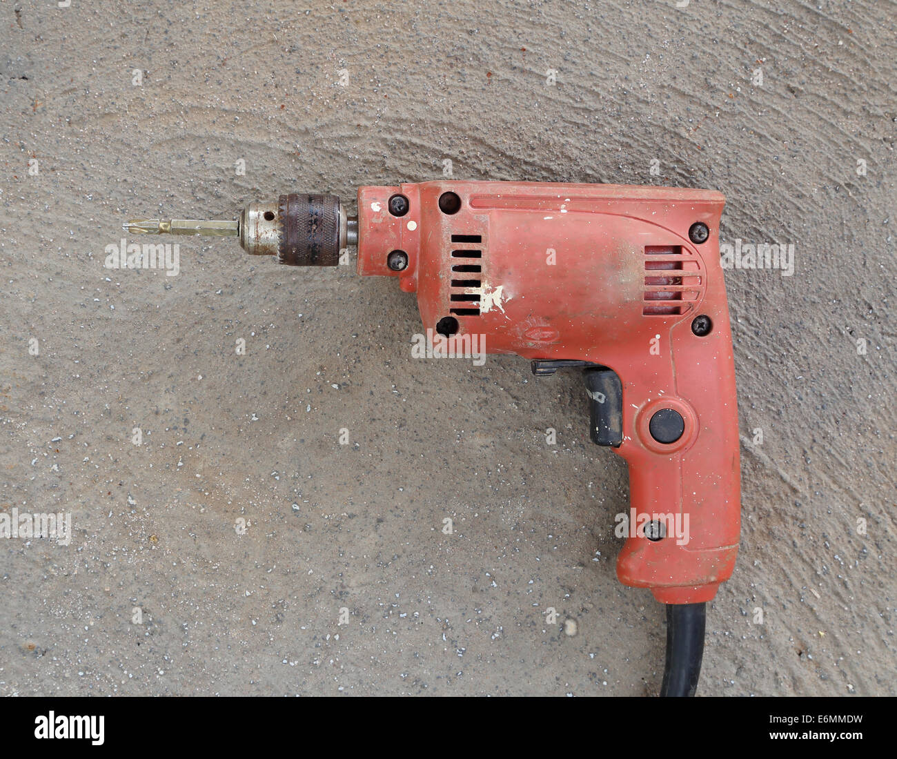 old drill with concrete background Stock Photo - Alamy