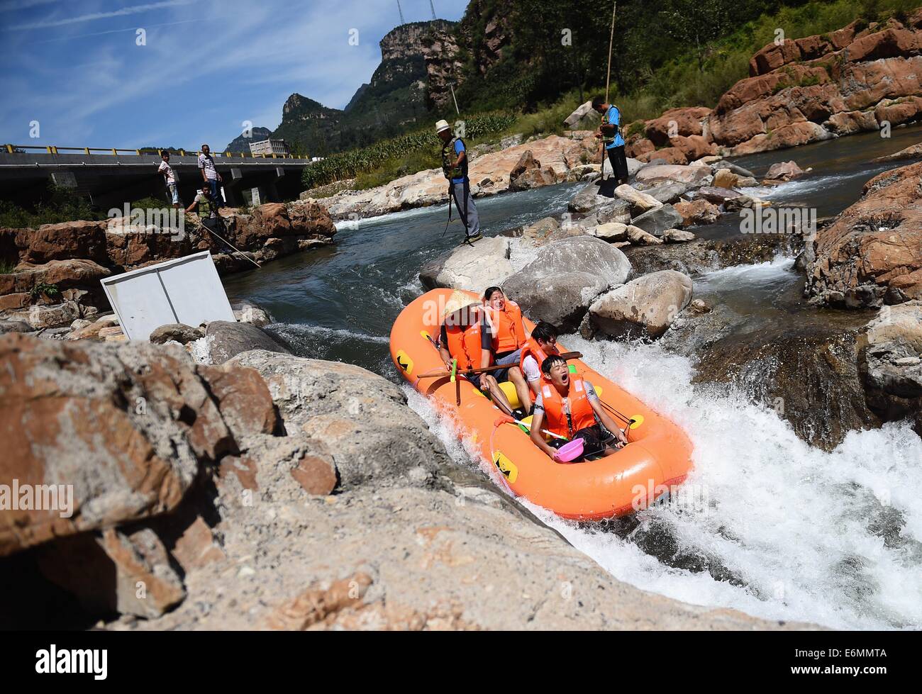 Xinglong, China's Hebei Province. 27th Aug, 2014. Tourists drift down a ...