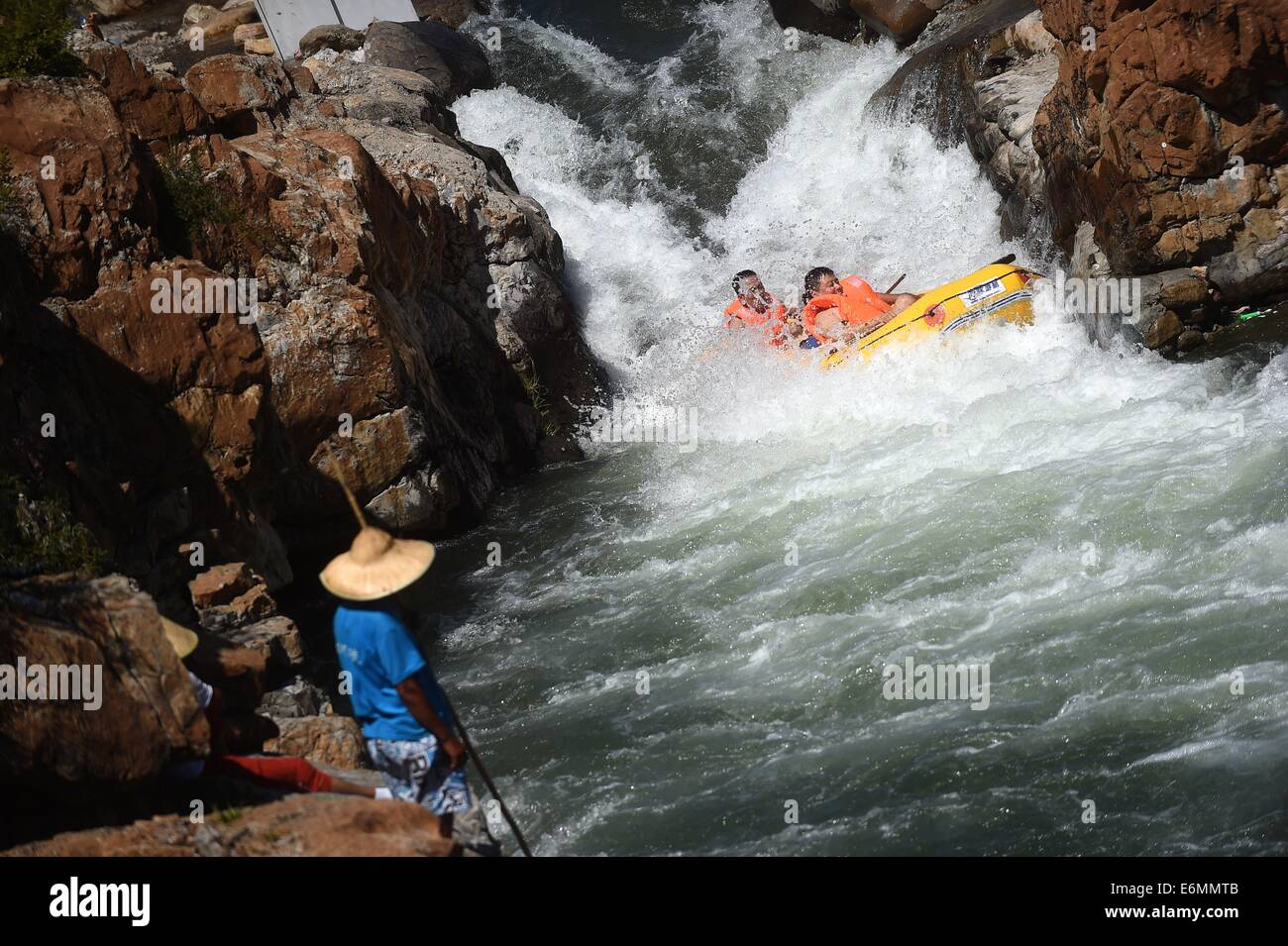 Xinglong, China's Hebei Province. 27th Aug, 2014. Tourists drift down a ...