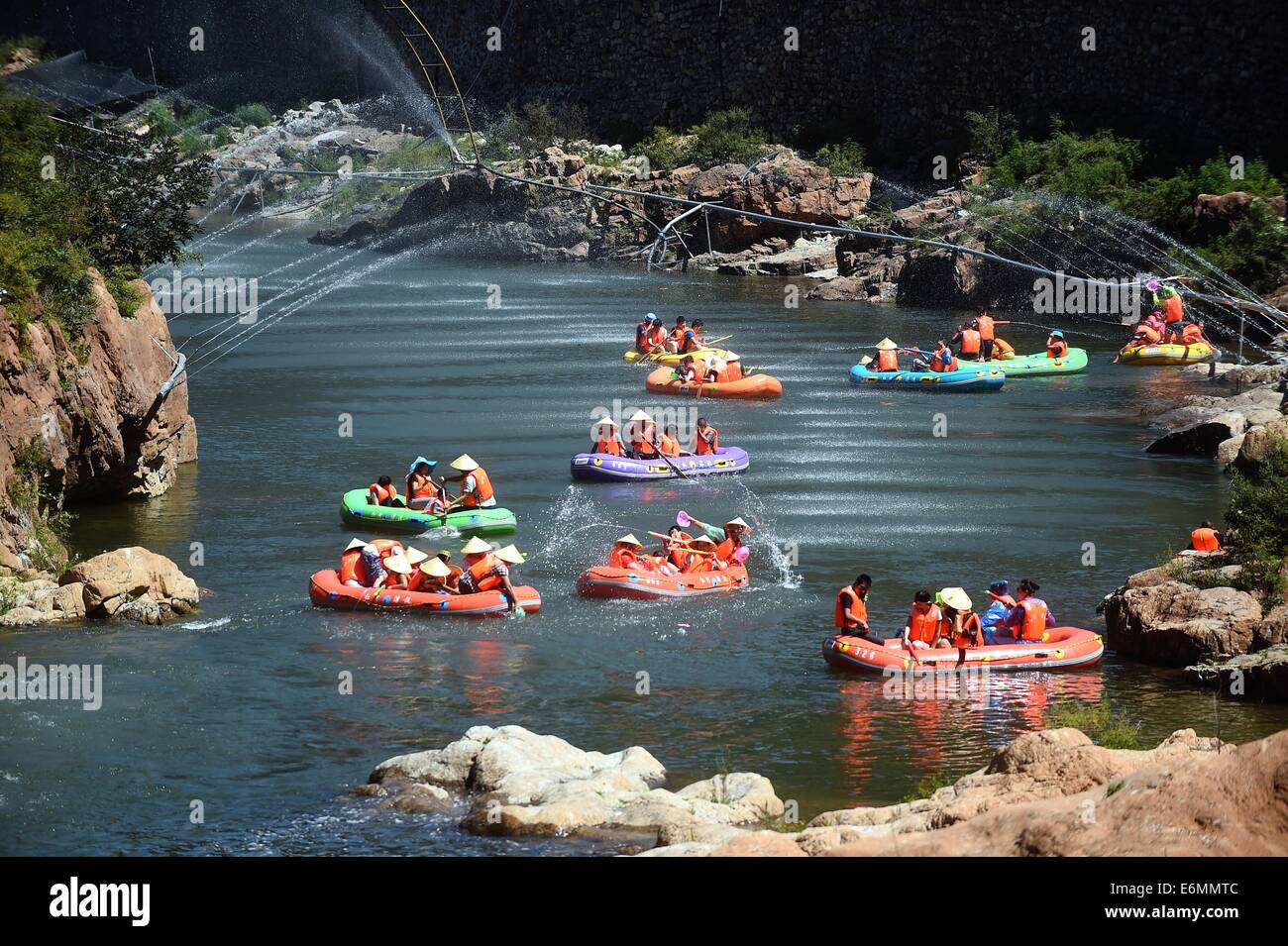 Xinglong, China's Hebei Province. 27th Aug, 2014. Tourists drift down a ...