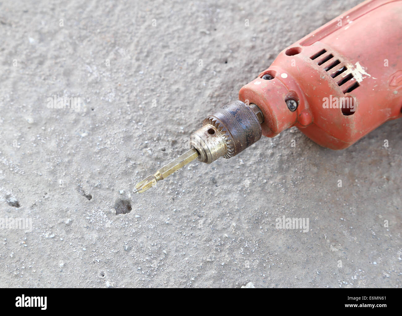 old drill with concrete background Stock Photo - Alamy