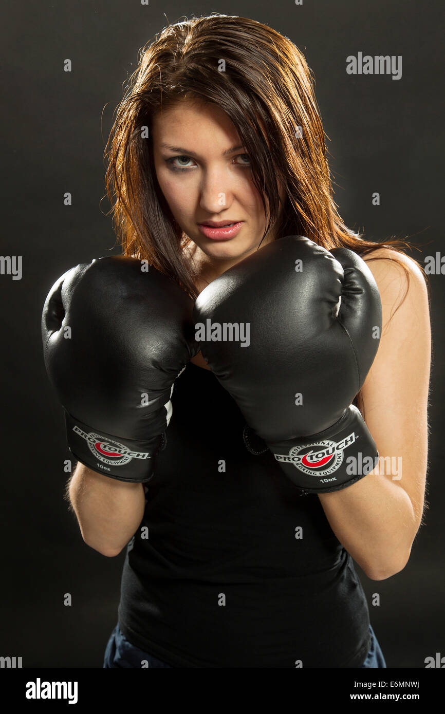 Woman wearing boxing gloves hi-res stock photography and images - Alamy