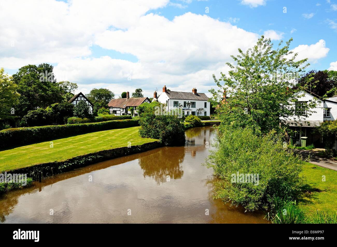 River Arrow with a pretty black and white timbered cottages to the rear ...