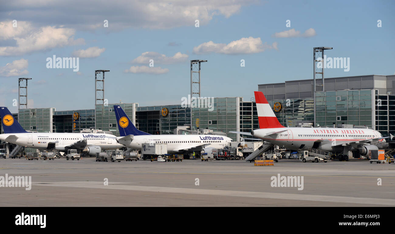 Two Airbus and a Boeing (C) on their parking positions at terminal 1 of ...
