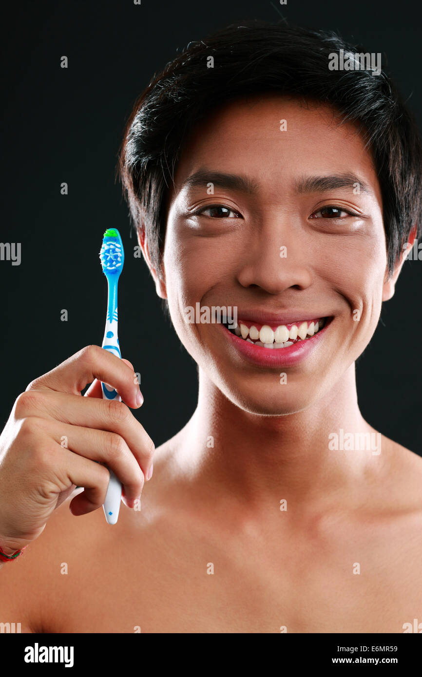 Teeth care young man with toothbrush Stock Photo - Alamy