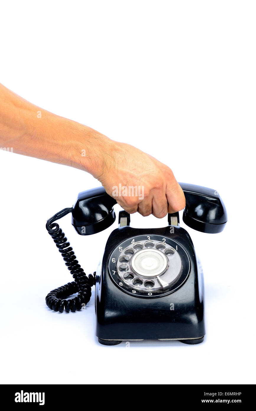 Hand holding an old black telephone isolated on white background Stock ...