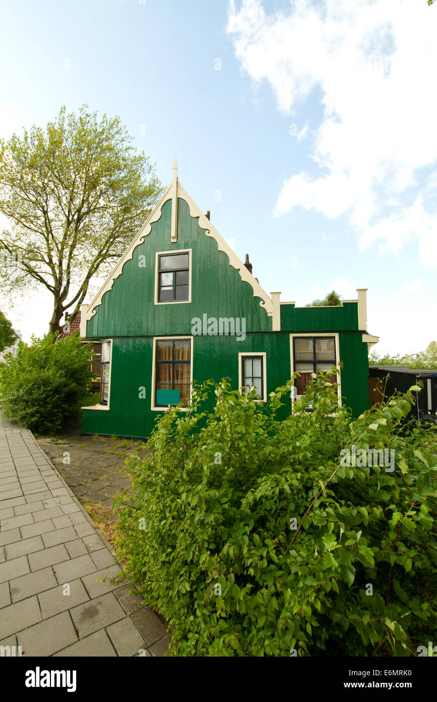 rural dutch scenery of small old houses and canal in Zaanse ...