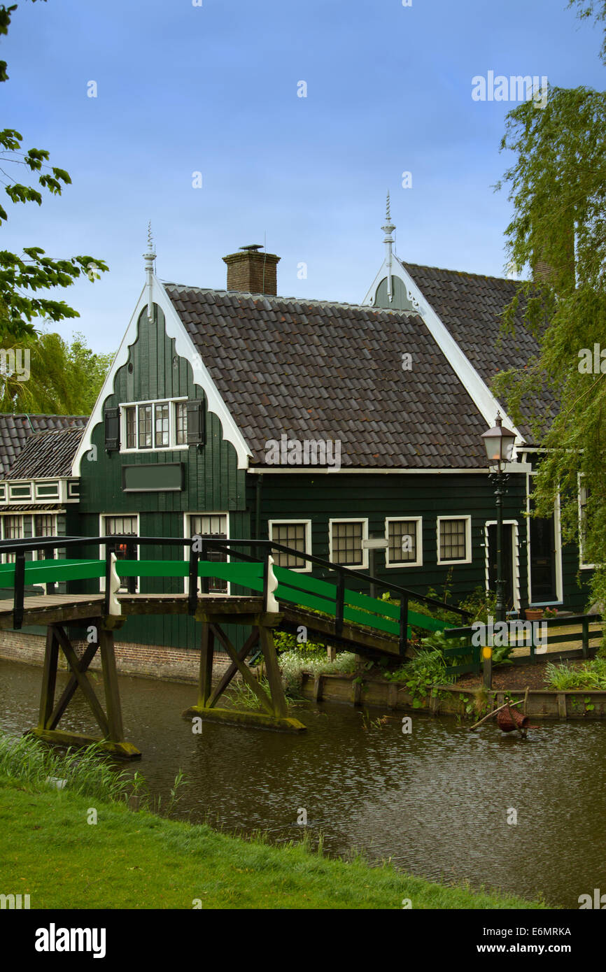 rural dutch scenery of small old houses and canal in Zaanse ...