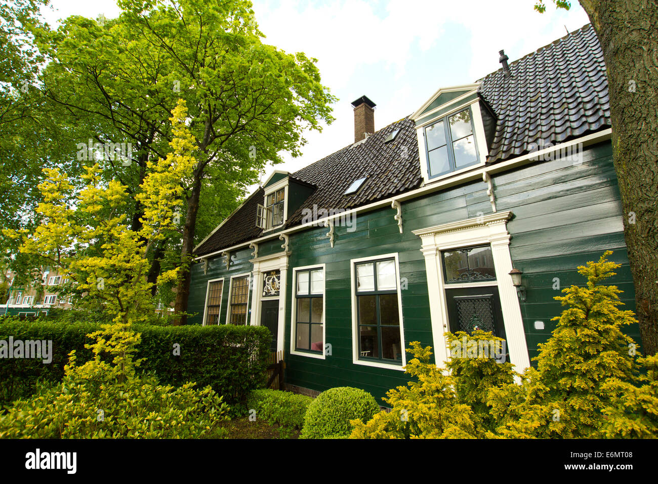 rural dutch scenery of small old houses and canal in Zaanse ...
