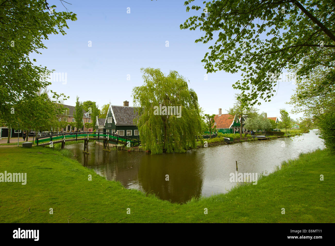 rural dutch scenery of small old houses and canal in Zaanse ...