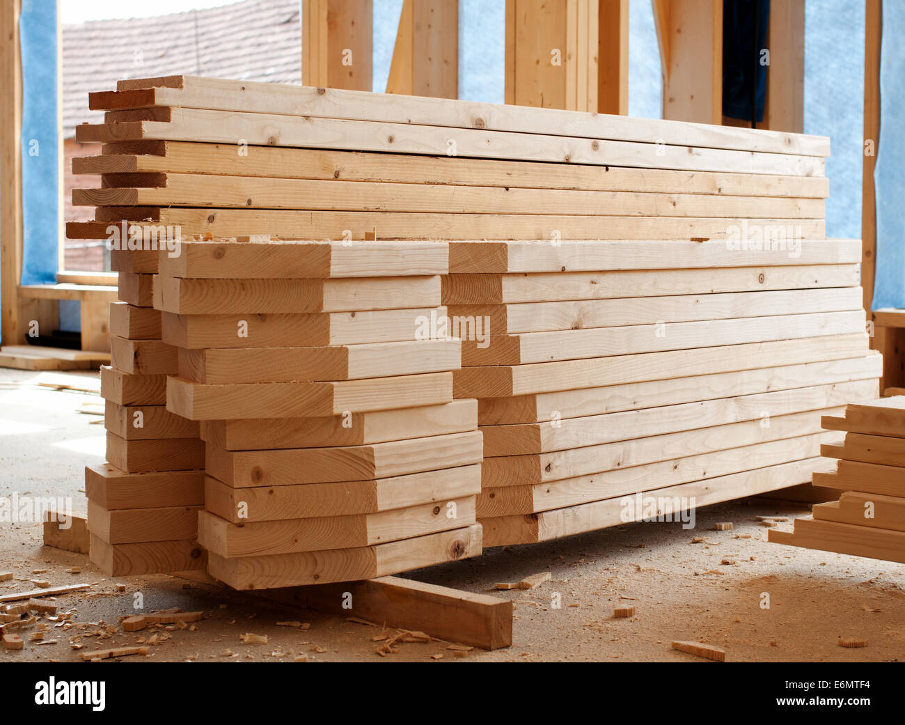 Stack of wooden planks inside house Stock Photo - Alamy