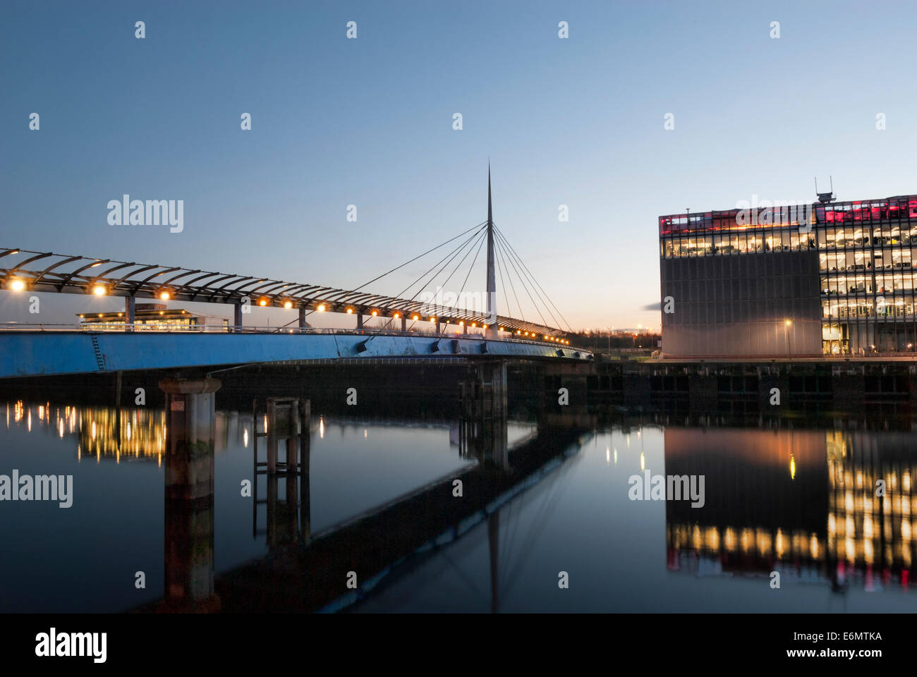 A night photograph of the BBC Scotland Headquarters and Bells bridge in ...