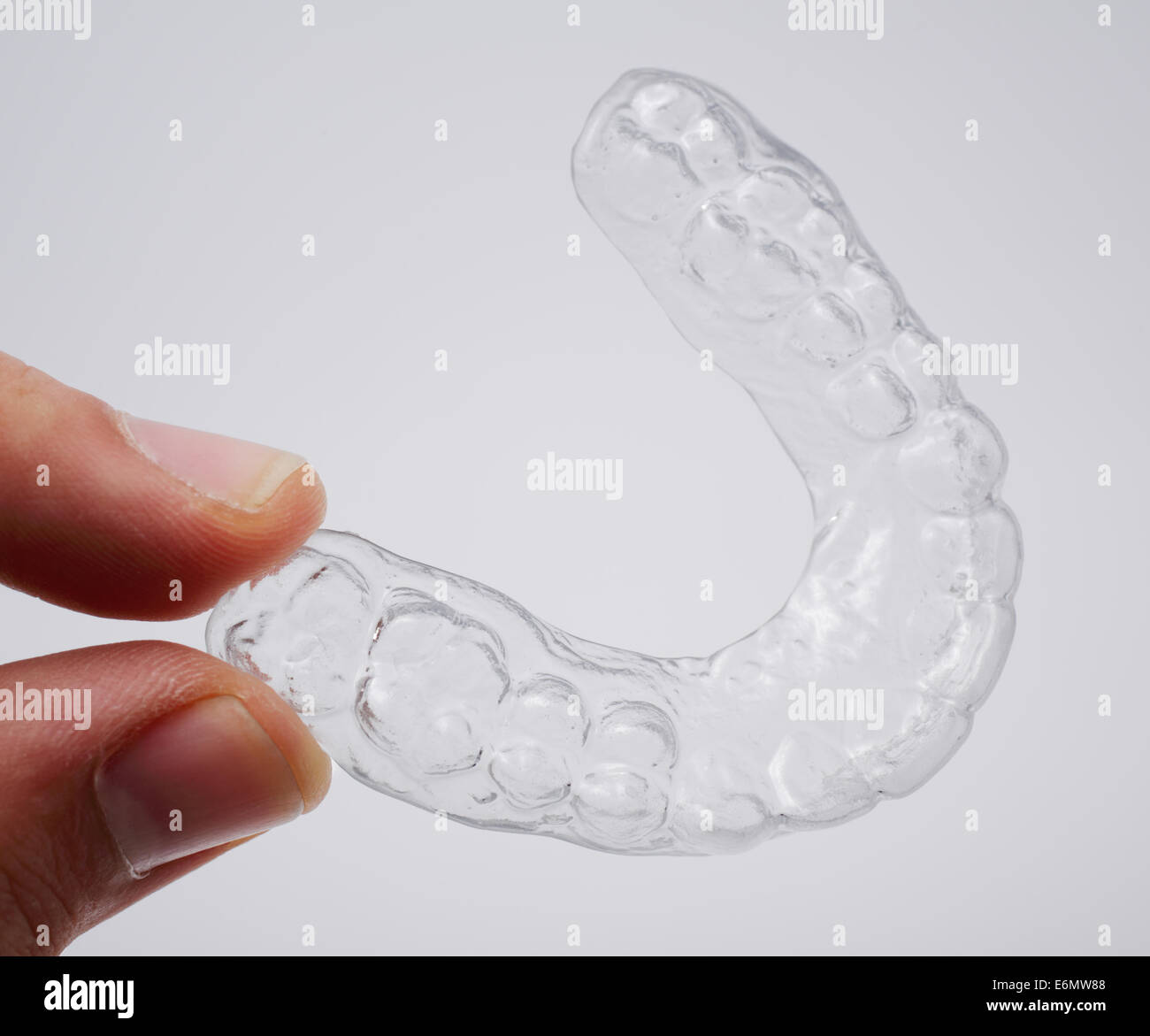 Translucent essix retainer Stock Photo - Alamy